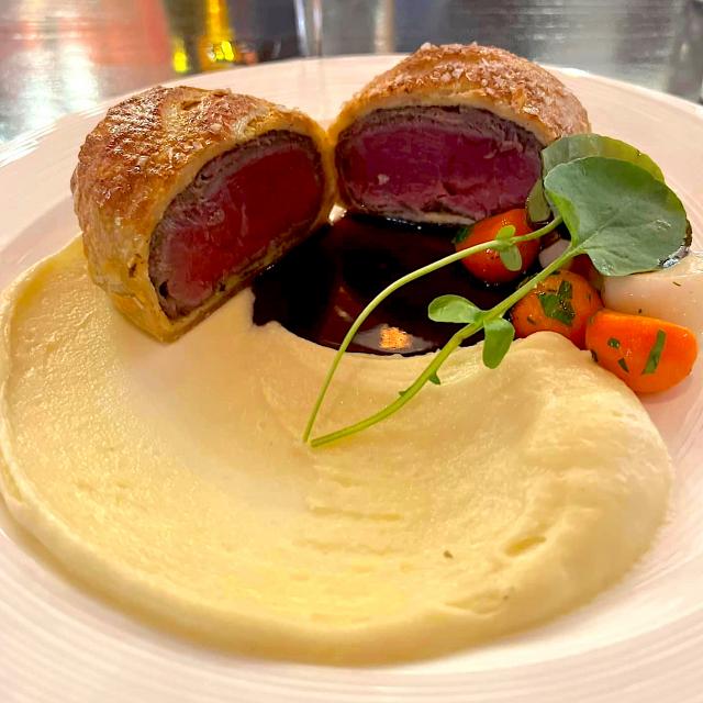 Hells kitchen Beef Wellingtonpotato pureeglazed root vegetablesred wine ...